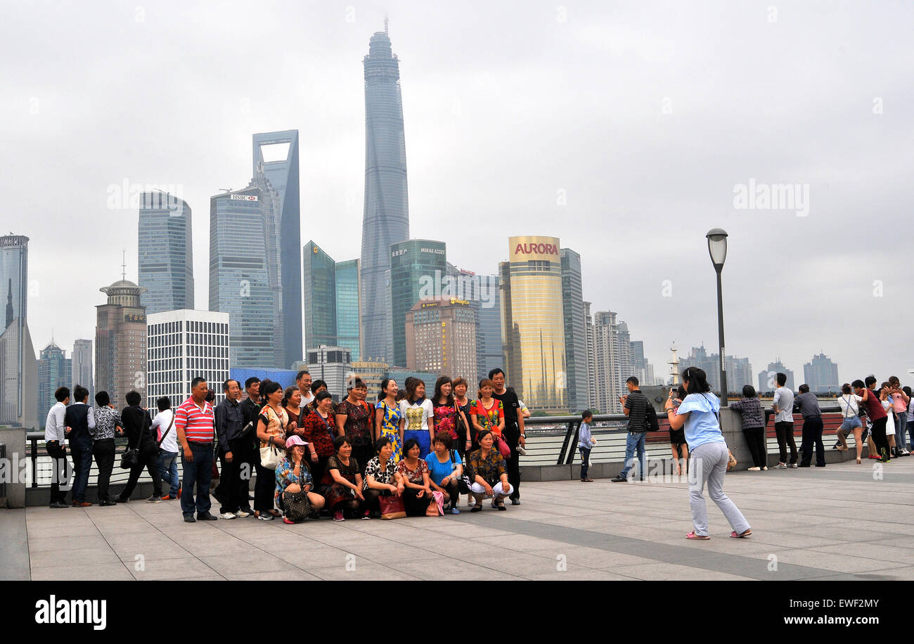 photo souvenir for a group of visitors before the skyline of Pudong ...