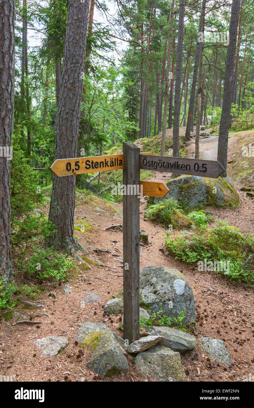 Signposts for hiking trails in the woods at Tivedens National park in ...