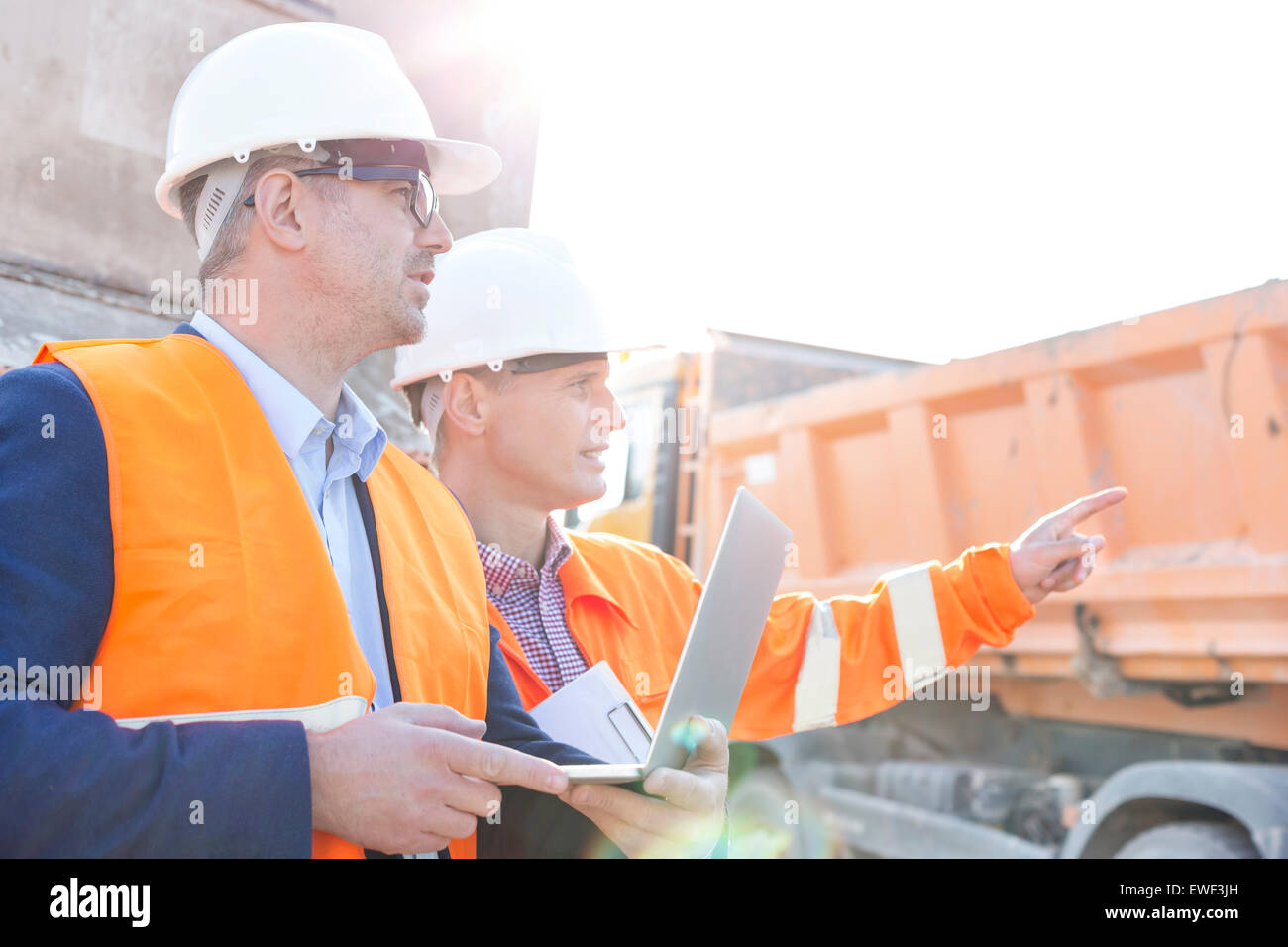 Engineer holding laptop colleague hi-res stock photography and images ...