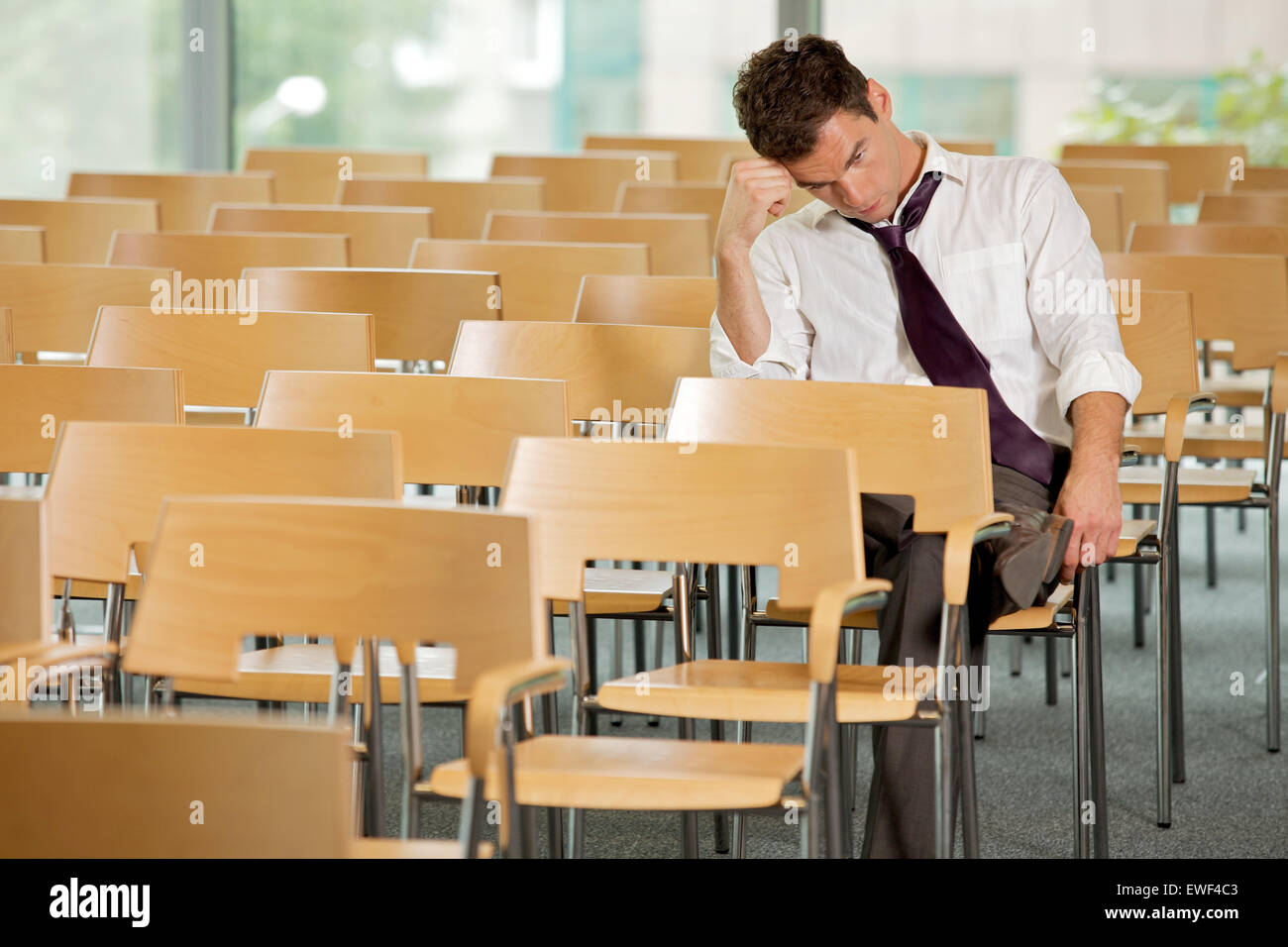 bored Businessman sitting at conference room Stock Photo - Alamy