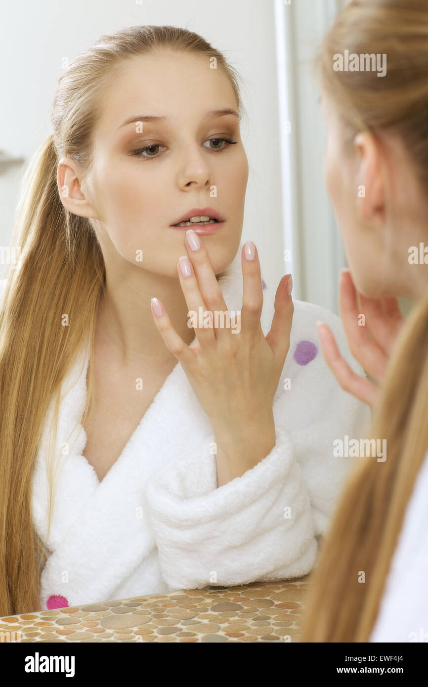 Mirror reflection woman applying hi-res stock photography and images ...