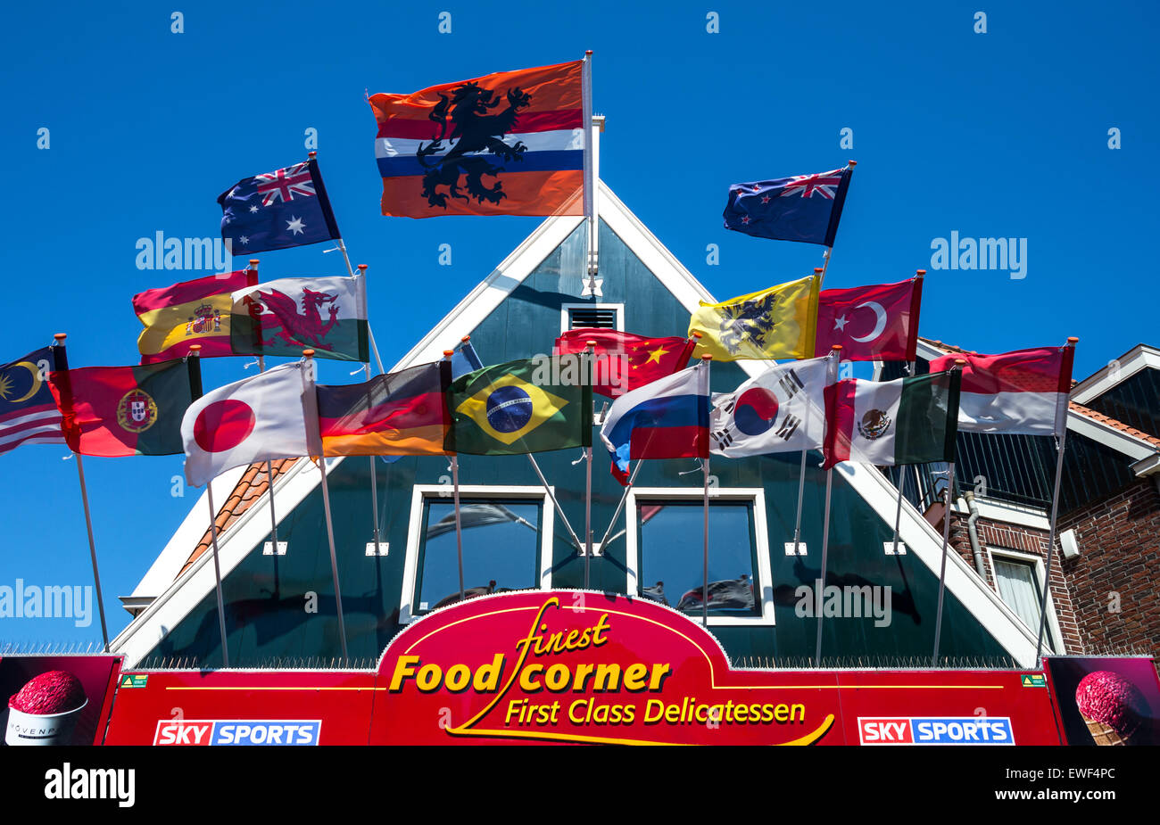 Amsterdam, Waterland district, Volendam, flags of a shop of the town ...