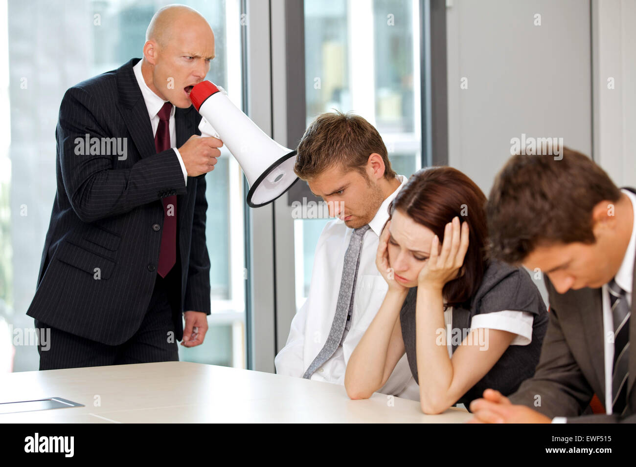 Young confident caucasian businessman screaming on his employee Stock ...