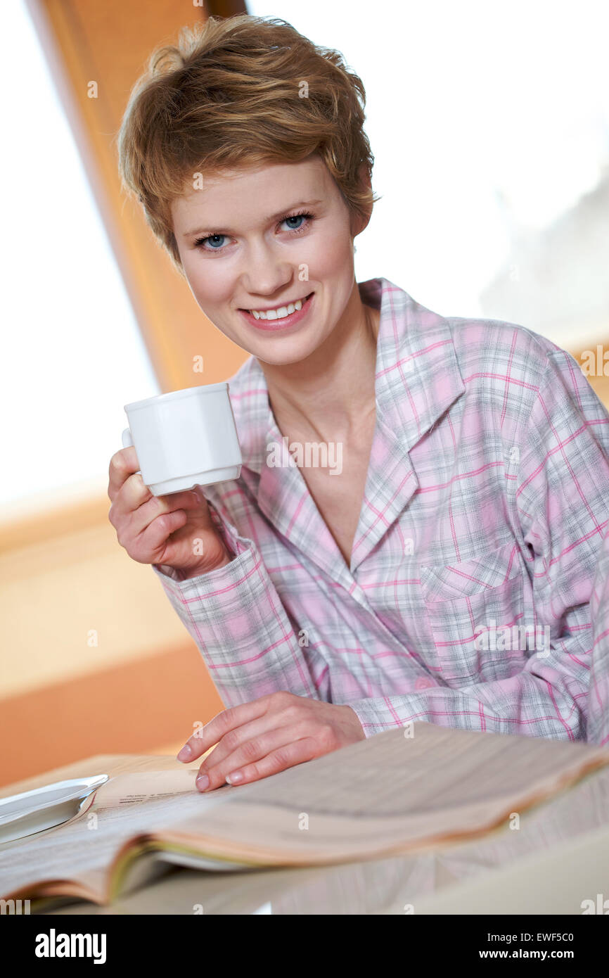Woman drinking coffee Stock Photo - Alamy
