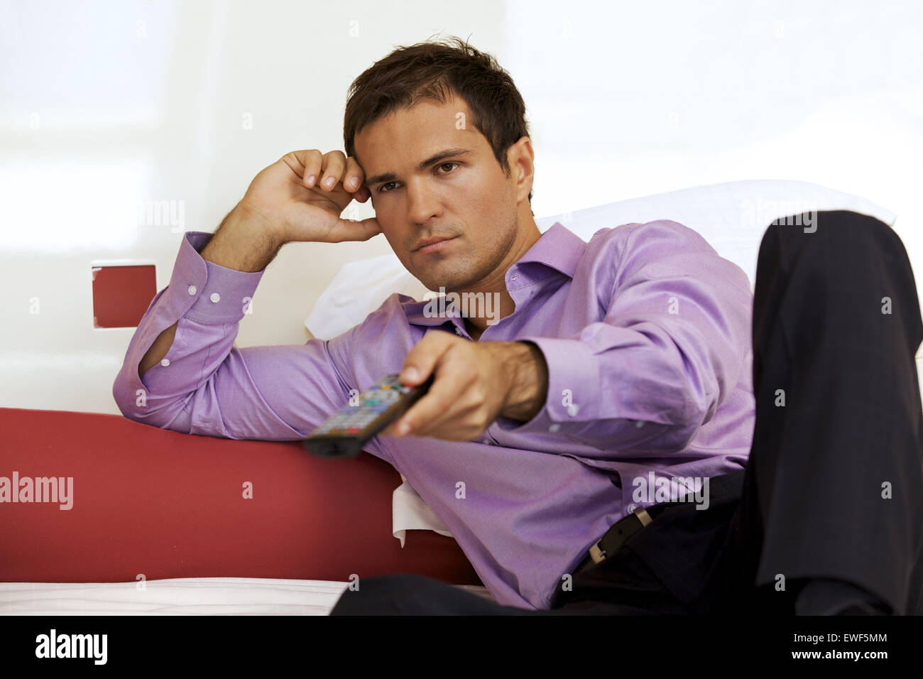 Man using remote control hi-res stock photography and images - Alamy