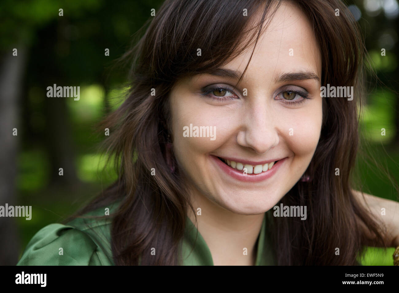 Portrait of cute young woman smiling Stock Photo - Alamy