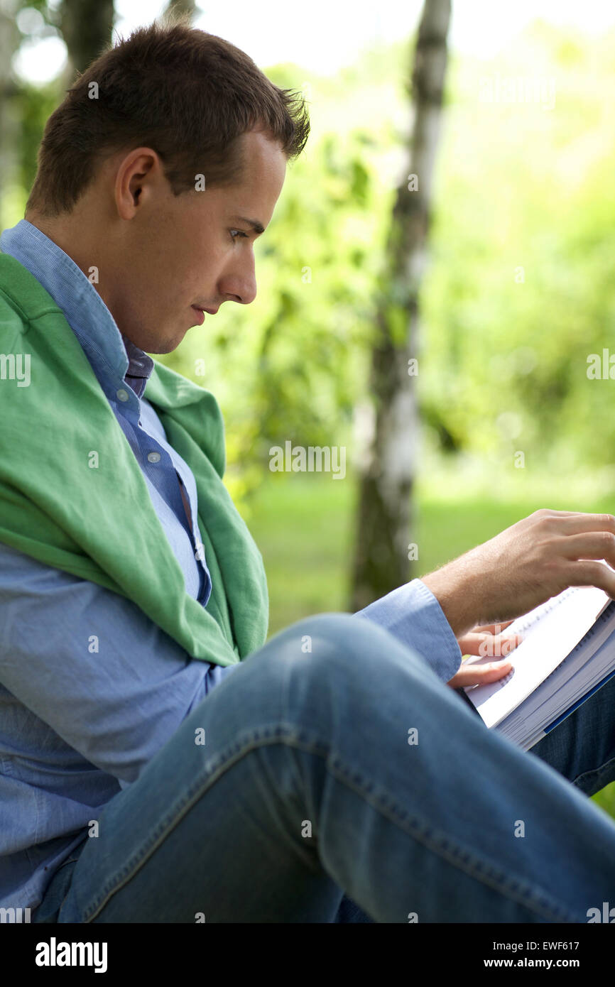 Man in park reading hi-res stock photography and images - Alamy
