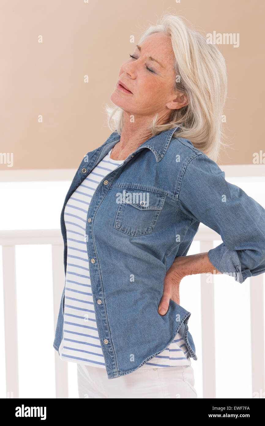 SENIOR WITH LOWER BACK PAIN Stock Photo - Alamy