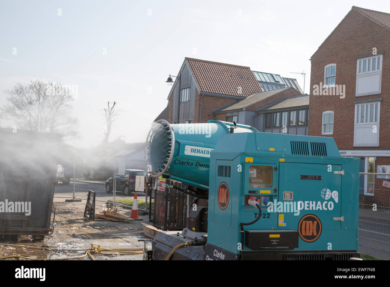 Dehaco water cannon sprayer dampening dust at a demolition site hi-res ...