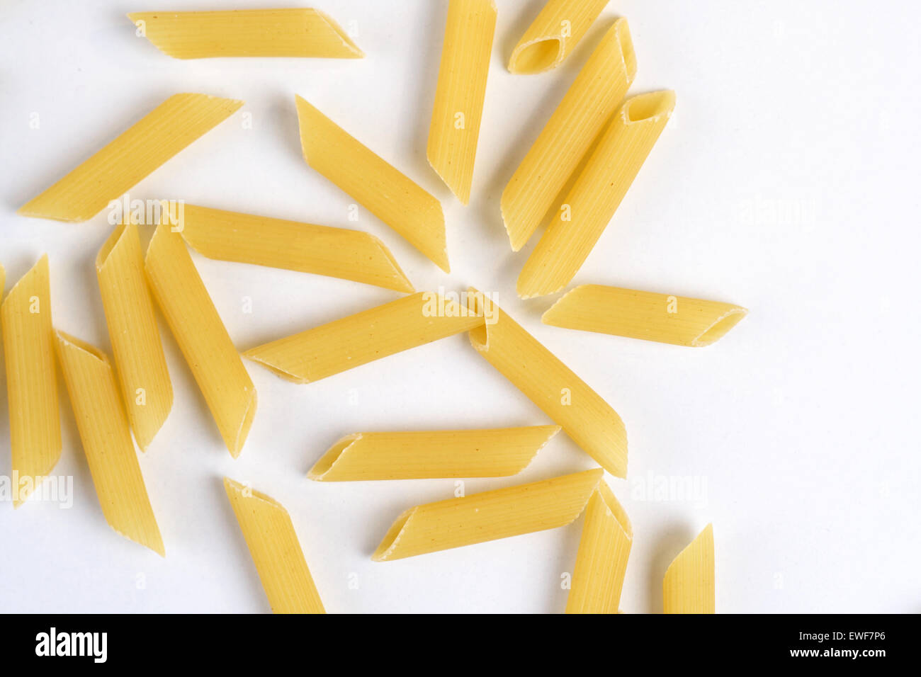 Penne pasta on white background Stock Photo - Alamy