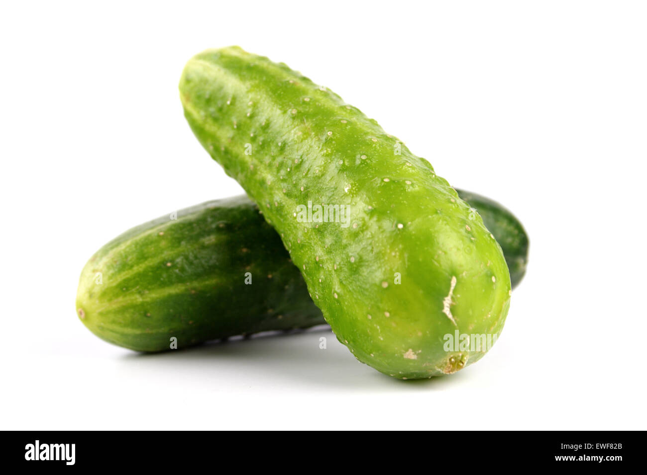 Two cucumbers on white background Stock Photo - Alamy