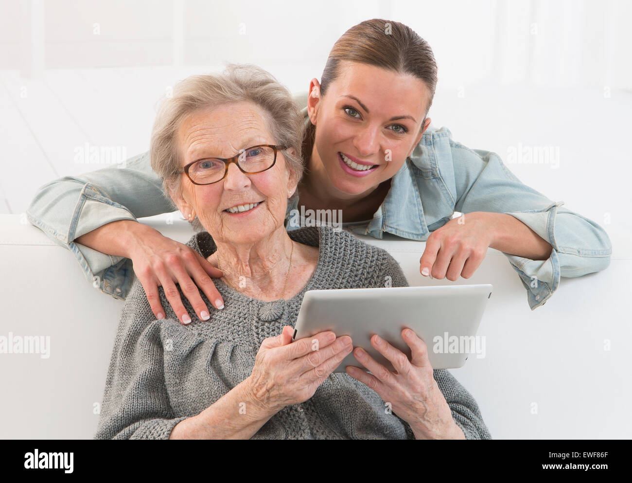 ELDERLY PERSON WITH TABLET Stock Photo - Alamy