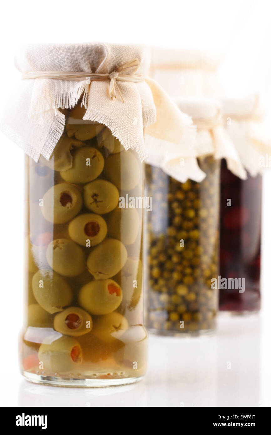 Pickled olives in jar - studio shot Stock Photo - Alamy