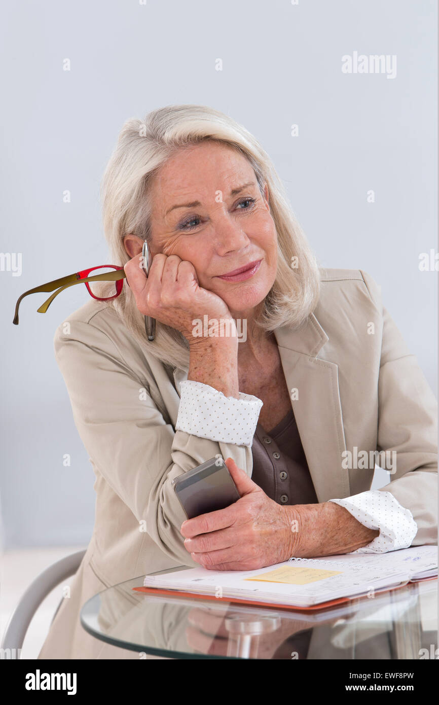 Elderly female worker office hi-res stock photography and images - Alamy