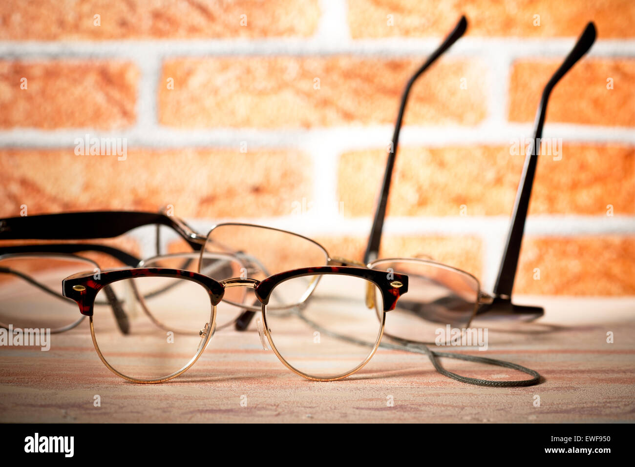 reading glasses and books on the table Stock Photo - Alamy