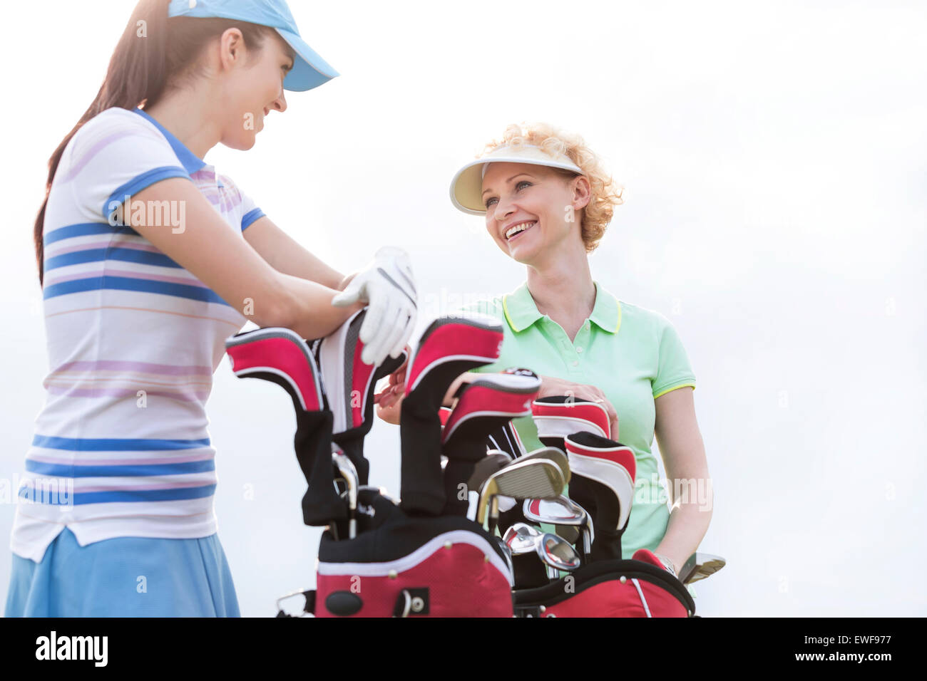 Happy female golfers talking golf hi-res stock photography and images ...
