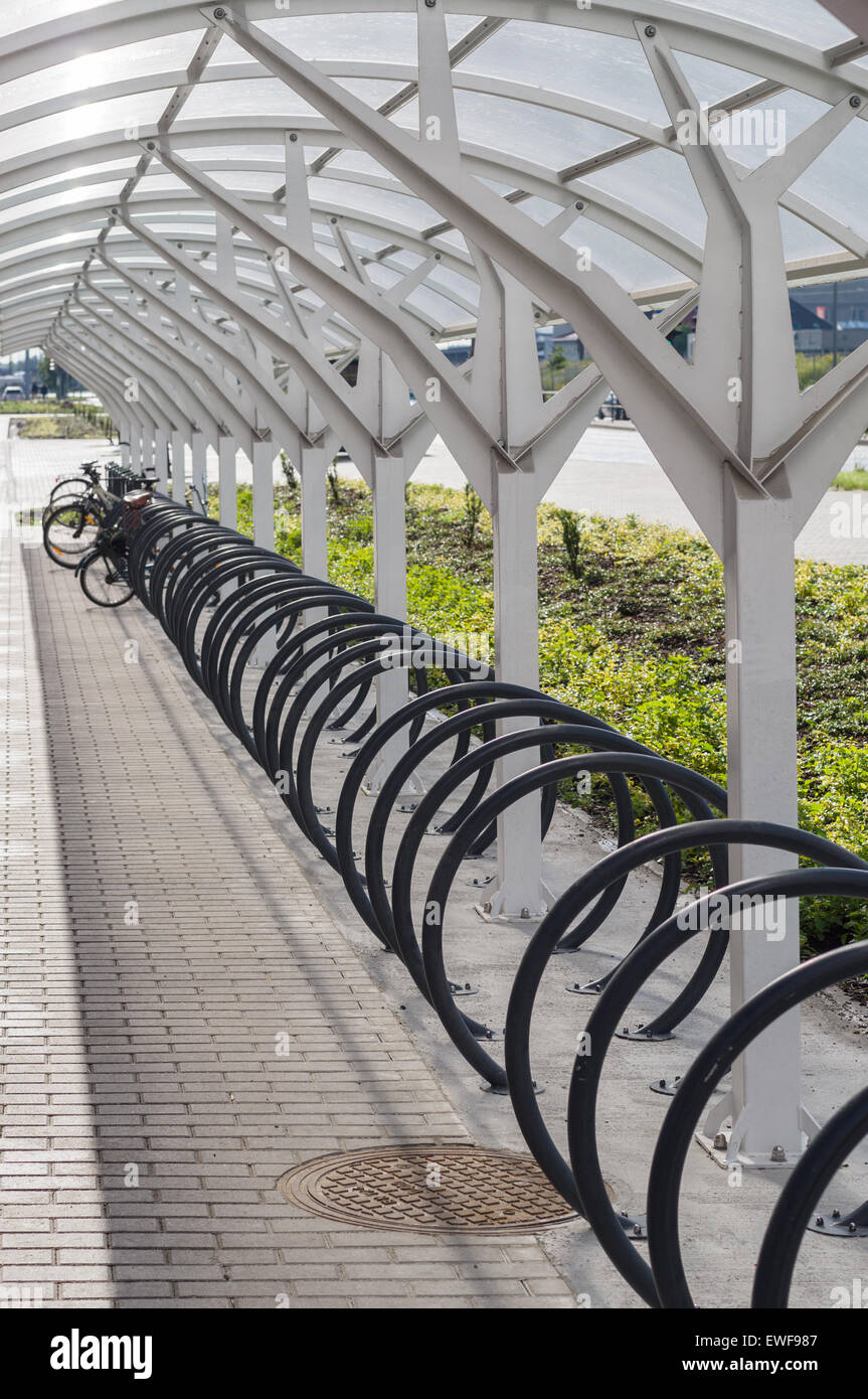 Modern bicycle parking area with roof Stock Photo - Alamy
