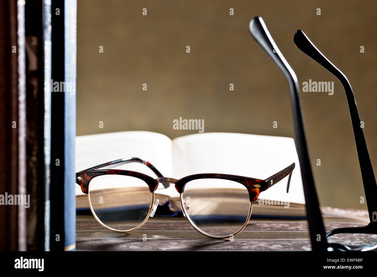 still life with eyeglasses and books on the table Stock Photo - Alamy