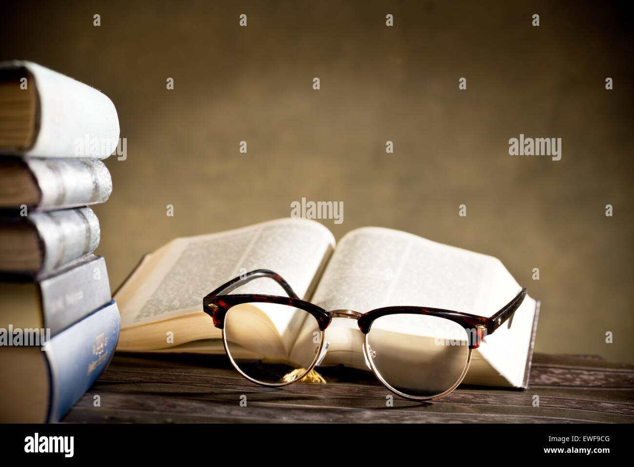 still life with eyeglasses and books on the table Stock Photo - Alamy