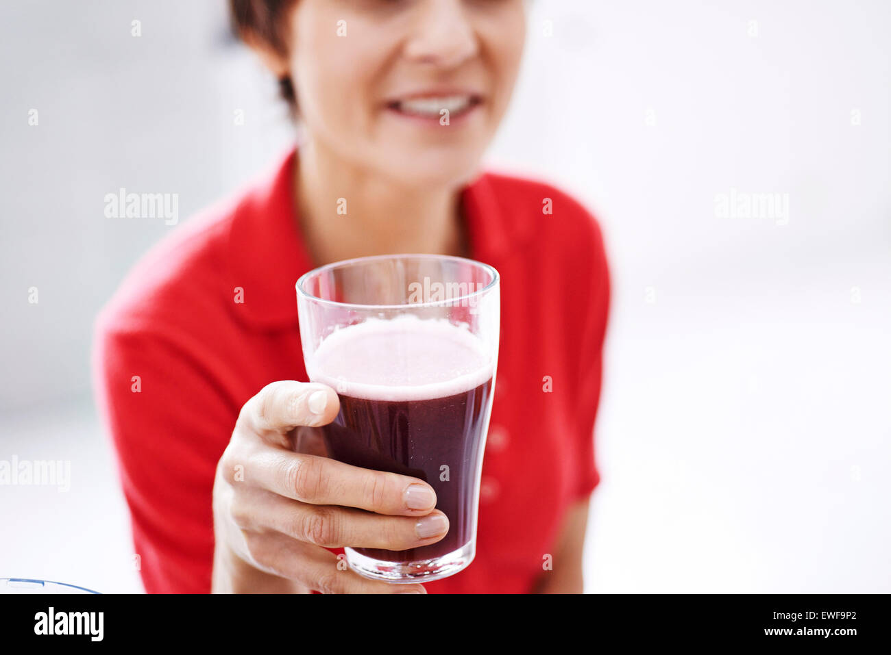 WOMAN WITH COLD DRINK Stock Photo - Alamy