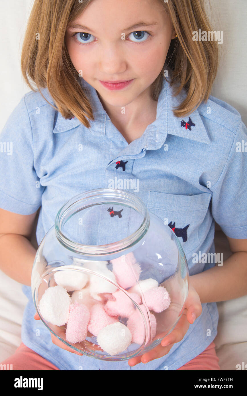 CHILD EATING SWEETS Stock Photo - Alamy