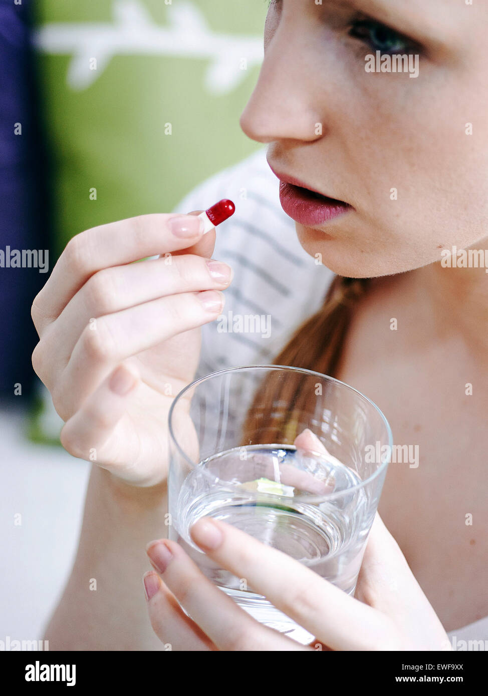 WOMAN TAKING MEDICATION Stock Photo - Alamy