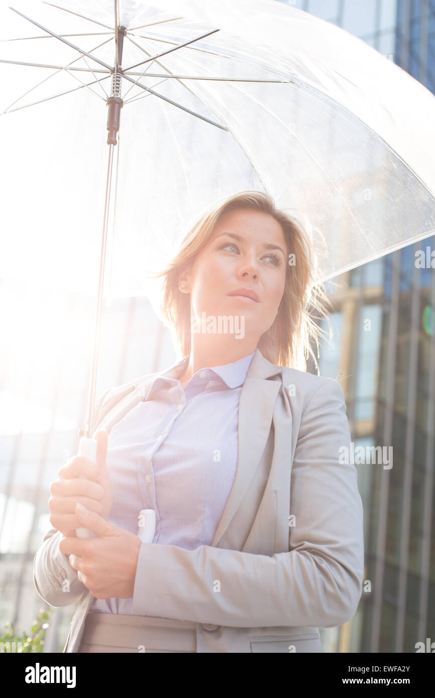 Person holding an umbrella hi-res stock photography and images - Alamy