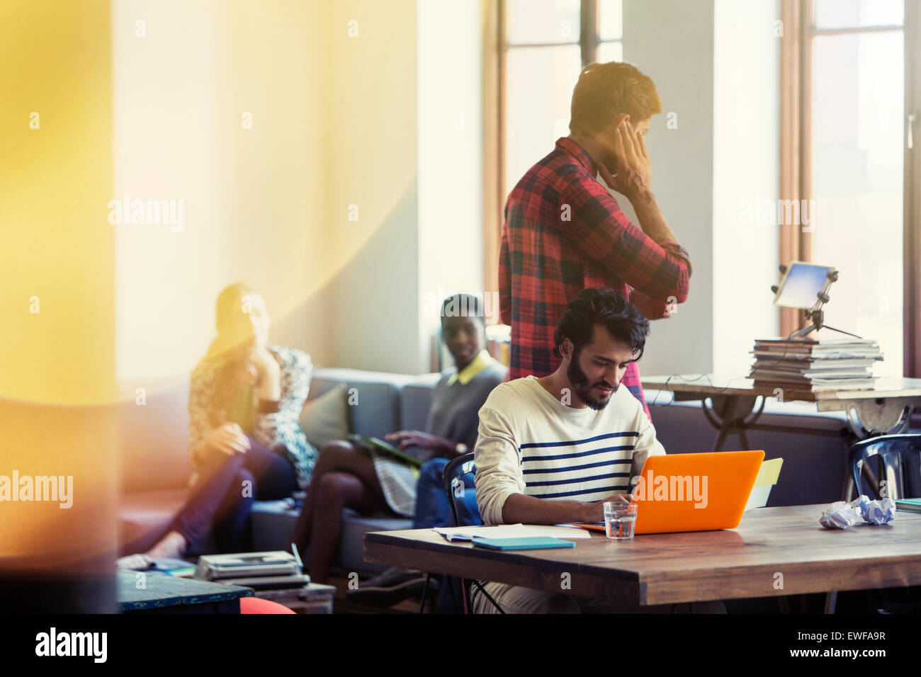 Casual business people working in office Stock Photo - Alamy
