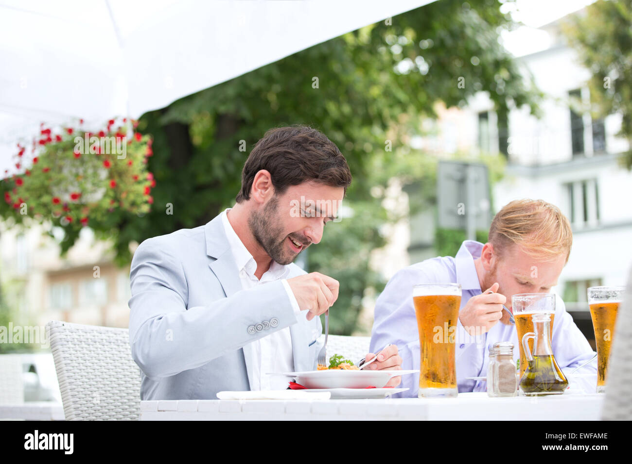 Two men eating restaurant hi-res stock photography and images - Alamy