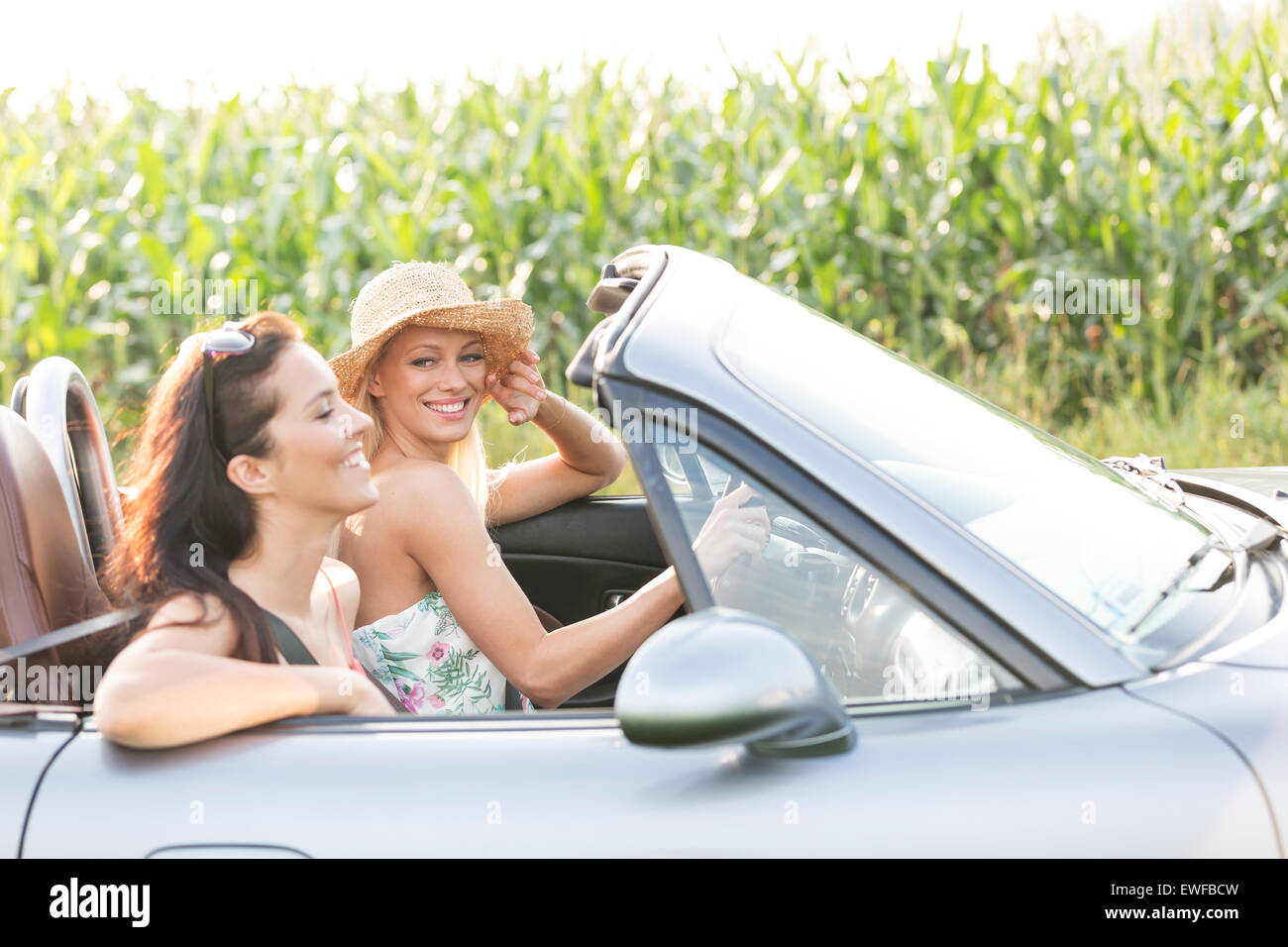 Two happy friends driving hi-res stock photography and images - Alamy