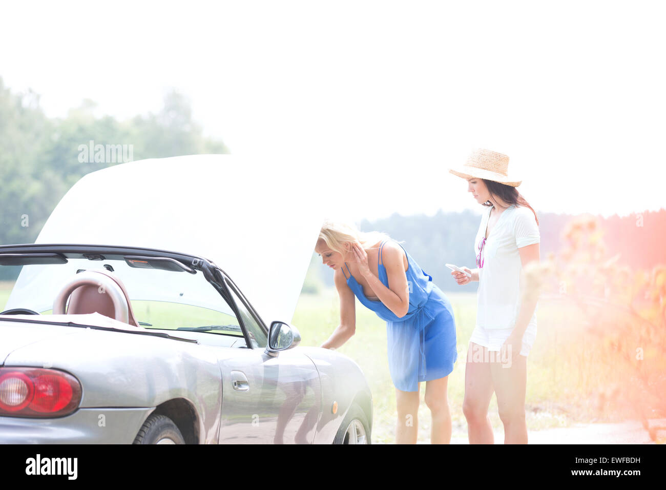 Woman Broken Down Car Looking High Resolution Stock Photography and ...