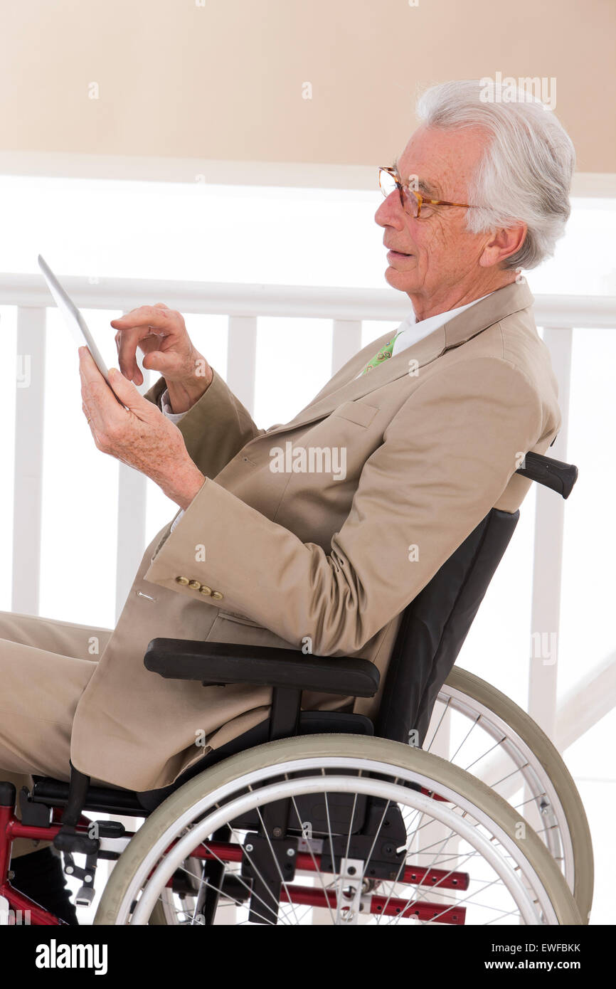 SENIOR WITH TABLET Stock Photo - Alamy