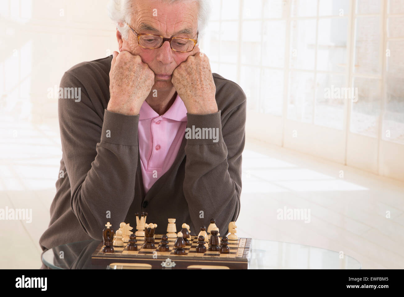 Old man playing chess alone hi-res stock photography and images - Alamy
