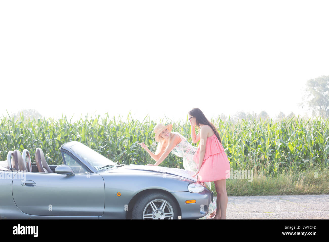 Two young women reading map hi-res stock photography and images - Alamy