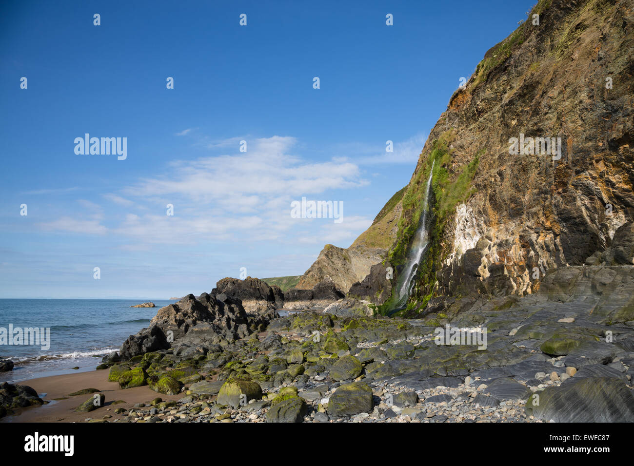 Coastal waterfall at the beach, Tresaith on the mid Wales coast Stock ...