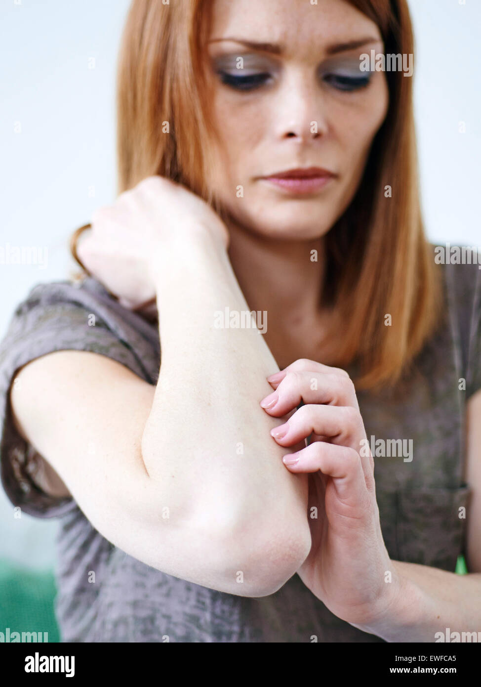 ITCHING IN A WOMAN Stock Photo - Alamy