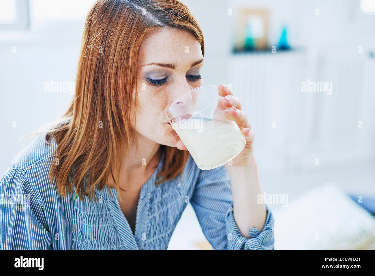 WOMAN WITH COLD DRINK Stock Photo - Alamy