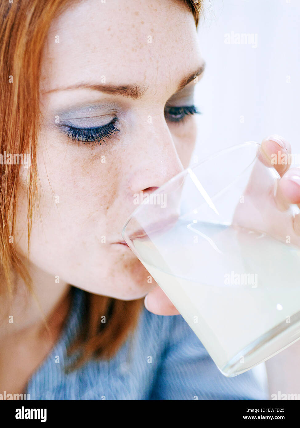 WOMAN WITH COLD DRINK Stock Photo - Alamy