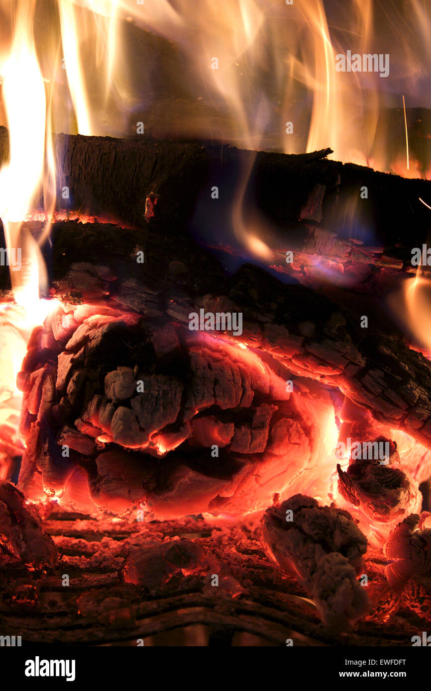 crest of flame on burning wood in fireplace Stock Photo - Alamy