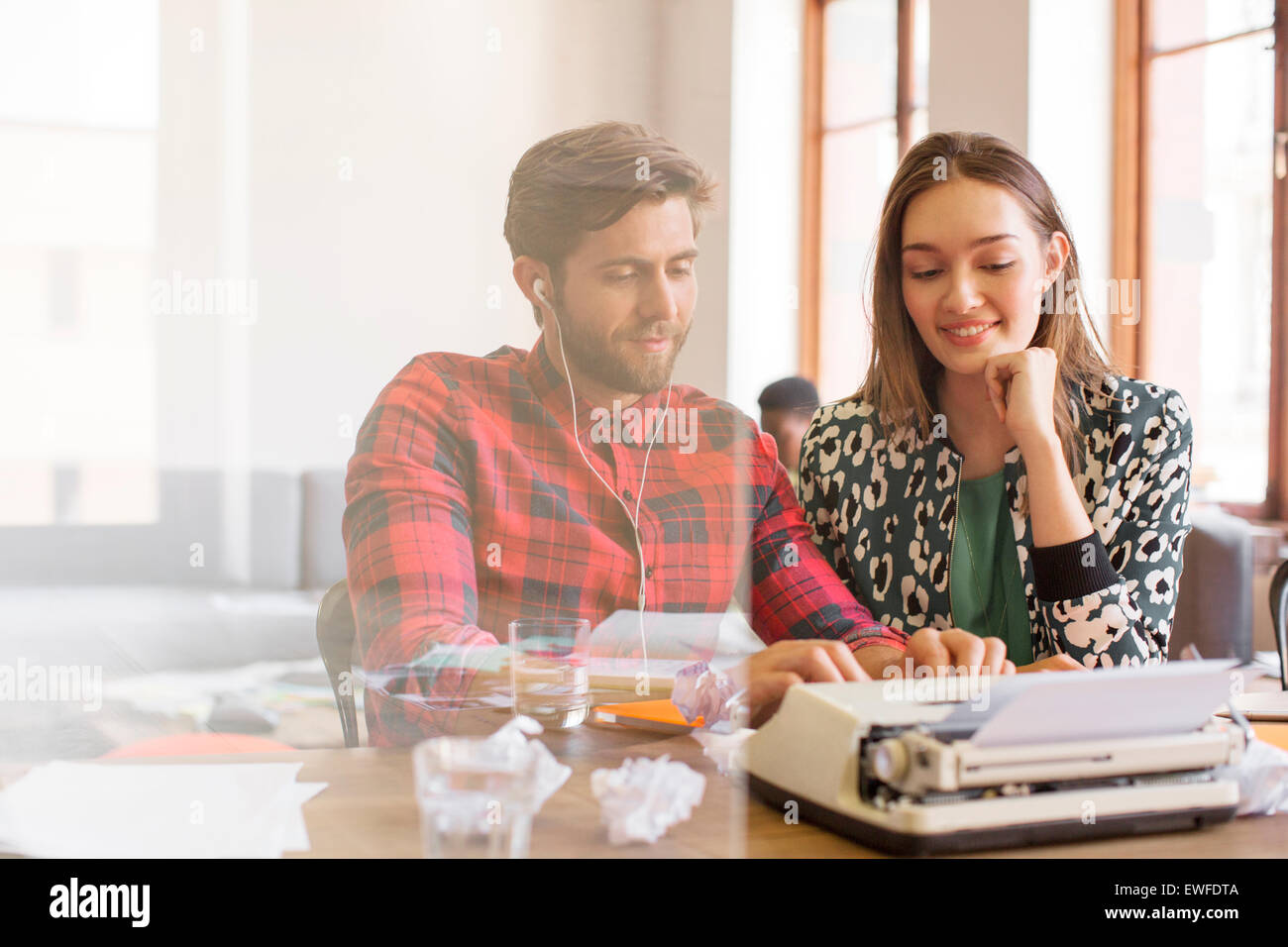 Creative business people working at typewriter Stock Photo - Alamy