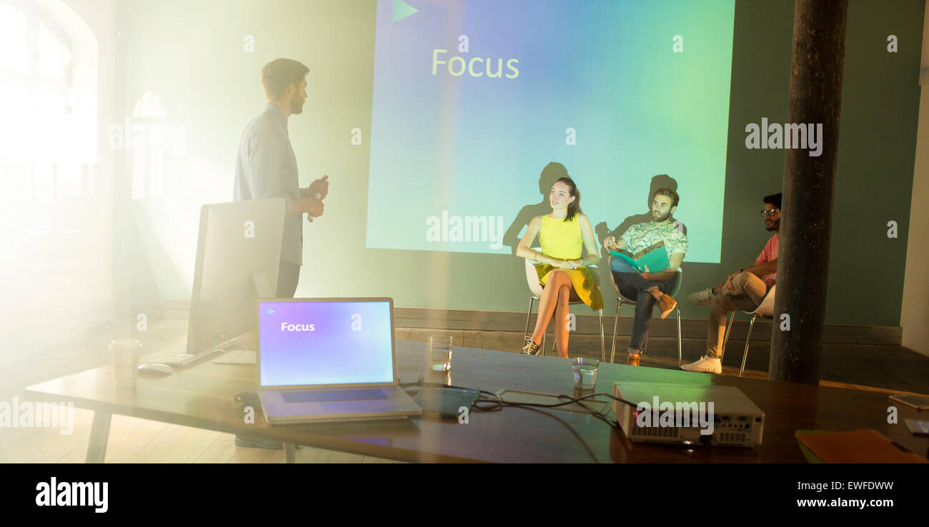 Business people preparing audio visual presentation on Focus Stock ...