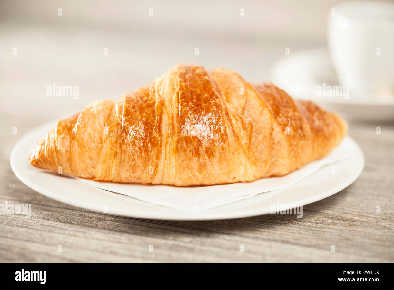 Croissant on plate Stock Photo - Alamy