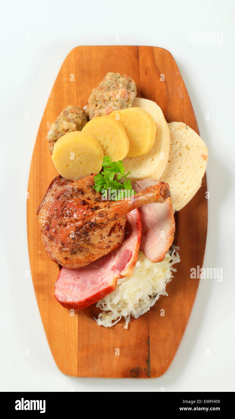 Roast duck and pork meat with three kinds of dumpling and white cabbage ...