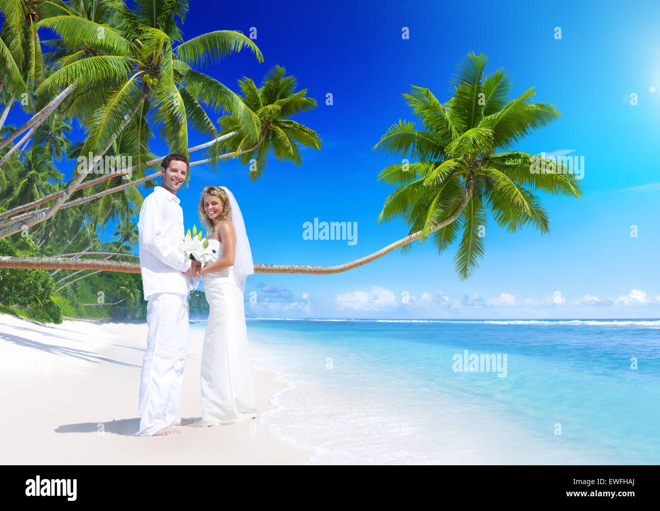 Couple getting marriage on the beach Stock Photo - Alamy