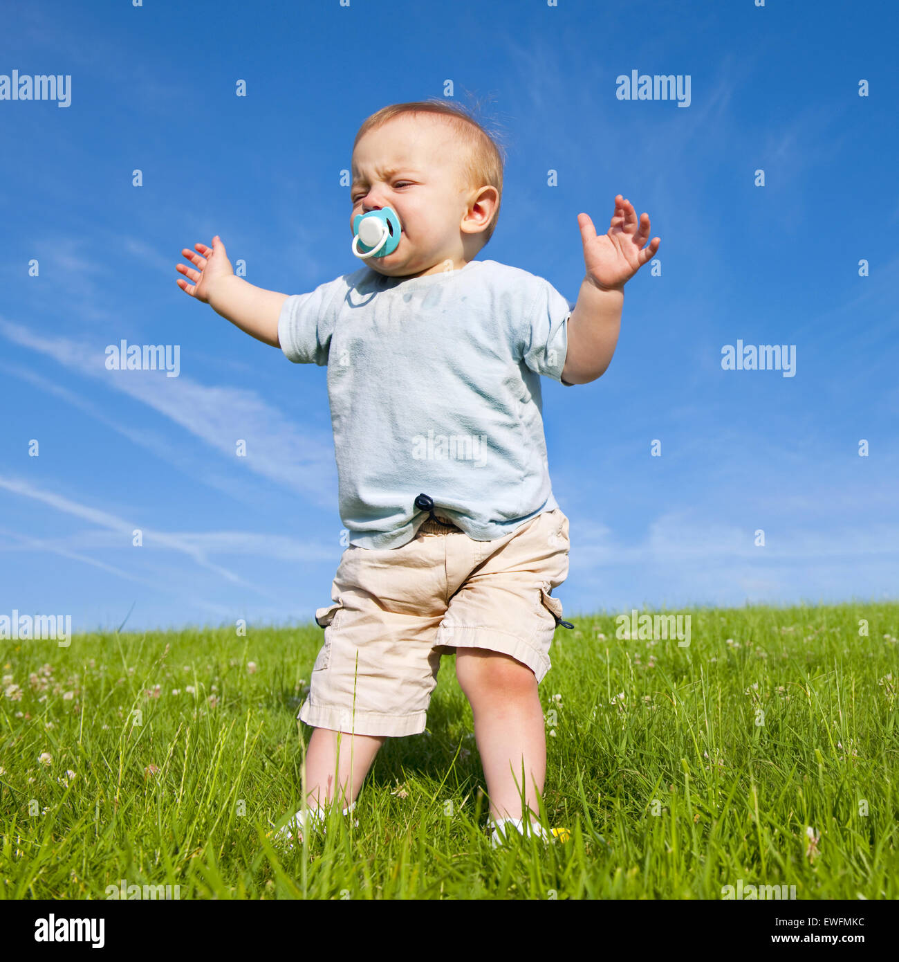 Baby lost in the grassland Stock Photo - Alamy