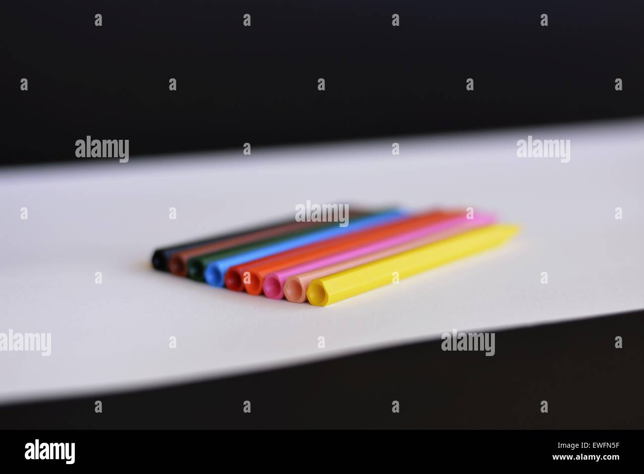 Crayons on a white paper Stock Photo - Alamy