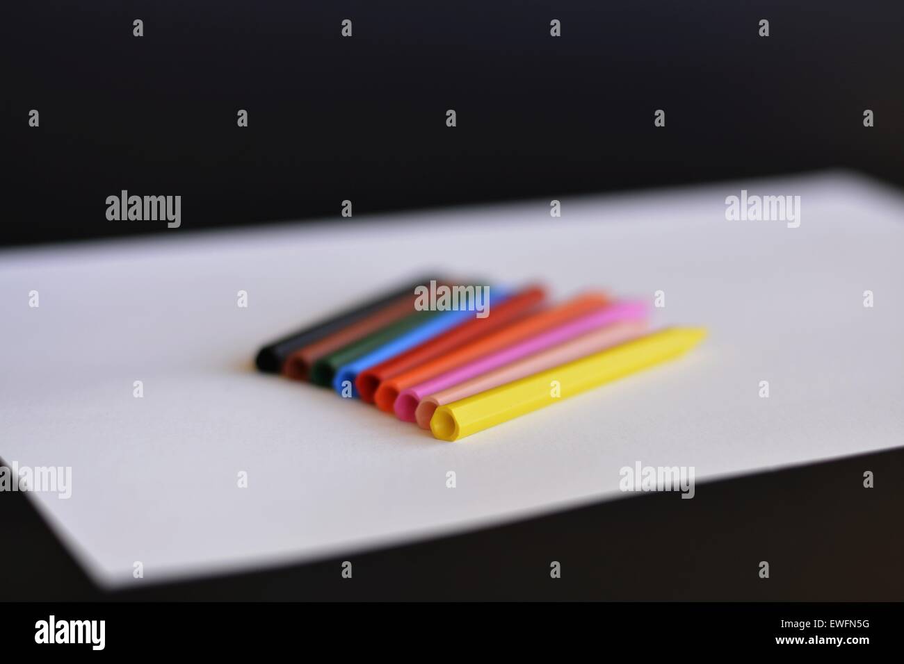 Crayons on a white paper Stock Photo - Alamy