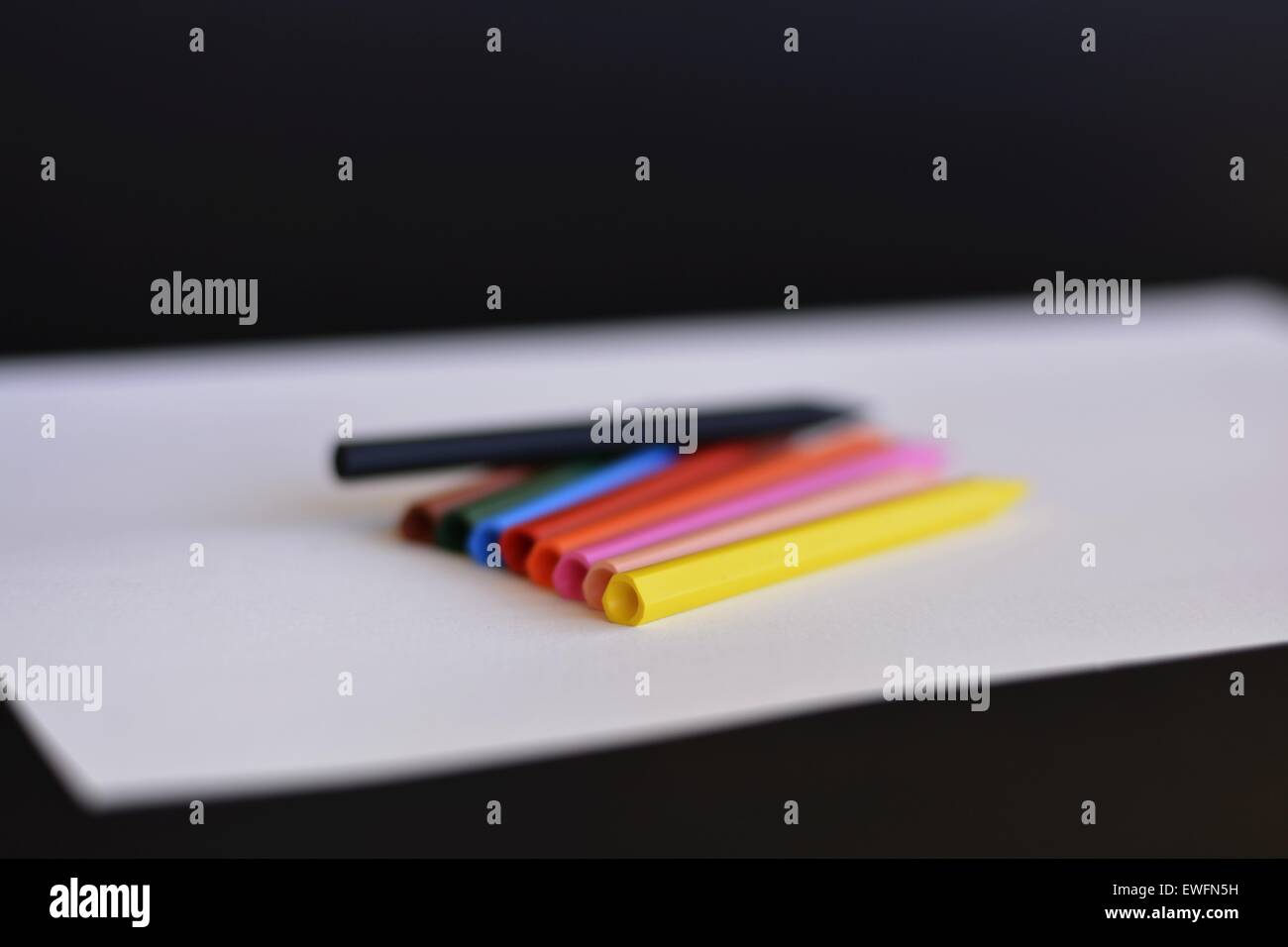 Crayons on a white paper Stock Photo - Alamy
