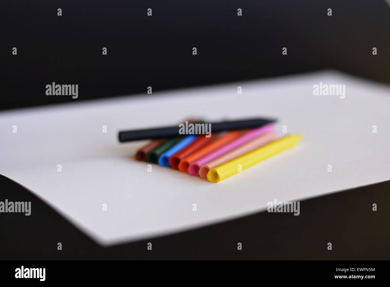 Crayons on a white paper Stock Photo - Alamy