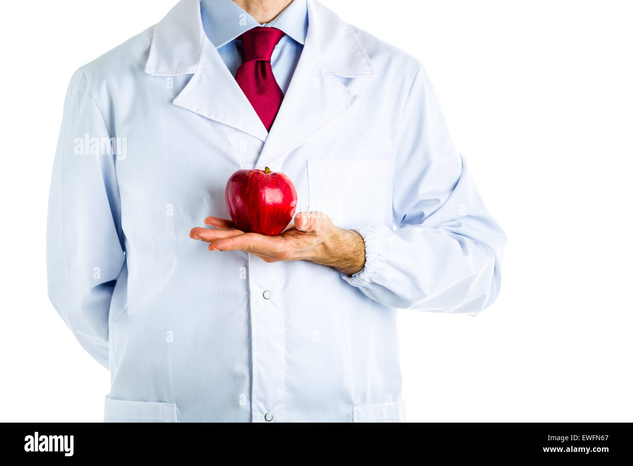 Caucasian male doctor dressed in white coat, blue shirt and red tie is ...